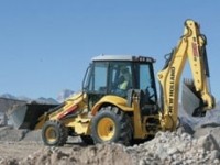 Backhoe loaders feature sloped, flip-up hood