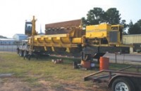 Versatile automatic compacting baler improved