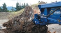Grinder-mounted stump splitter easily handles oversize material