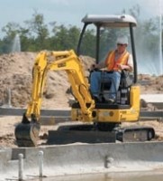 Compact zero tail swing excavator