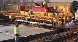 Concrete paving advances: paving mold and bar inserter