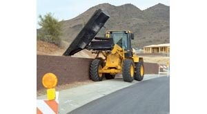 Side dump bucket makes material placement easier