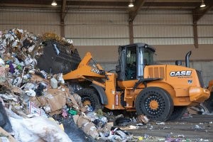 Waste handling loaders