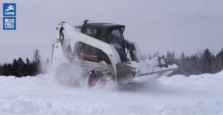 Over-the-tire tracks keep skid steers working through snow