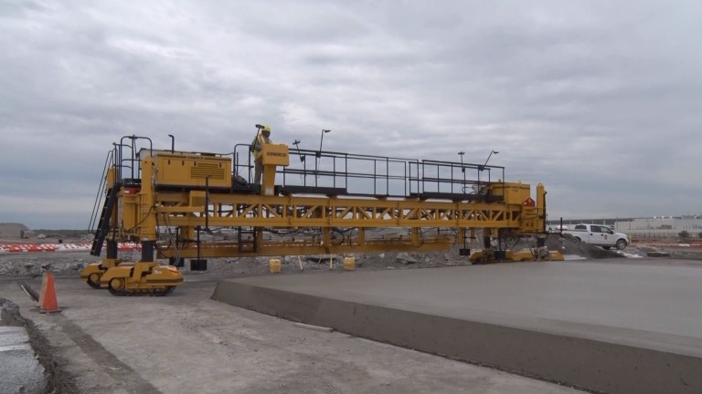 Watch GOMACO T/C-5600 texture/cure machine at work at Detroit airport