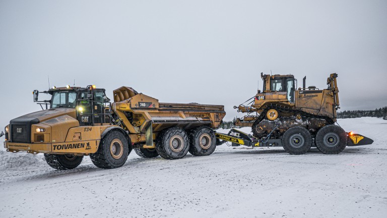 Sleipner off-road compact trailer connects to articulated dump trucks